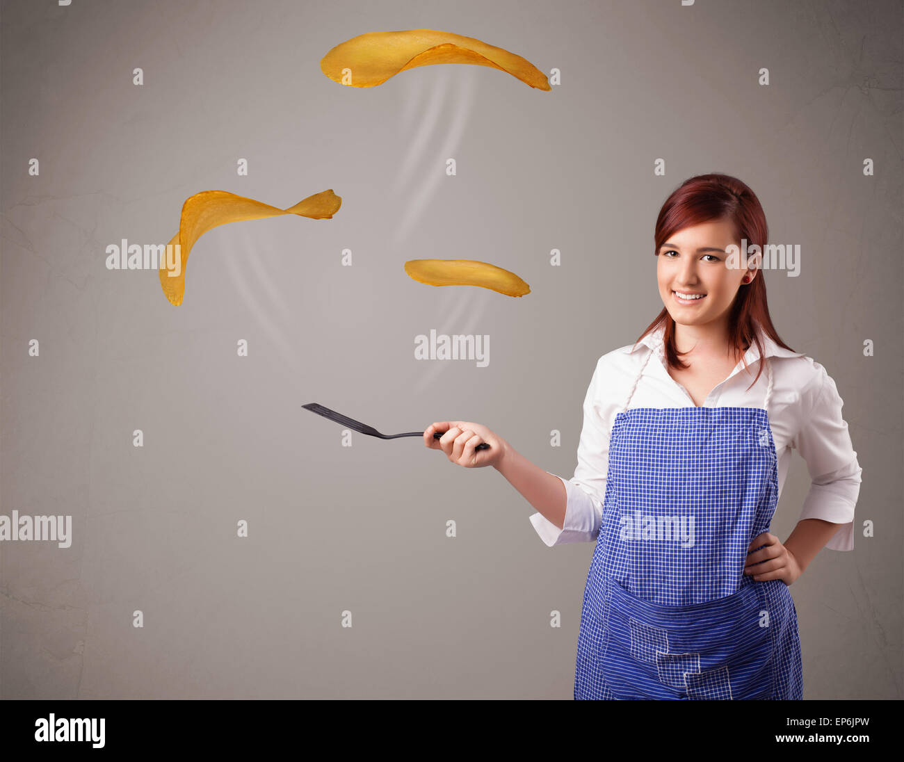 Woman making pancakes Stock Photo - Alamy