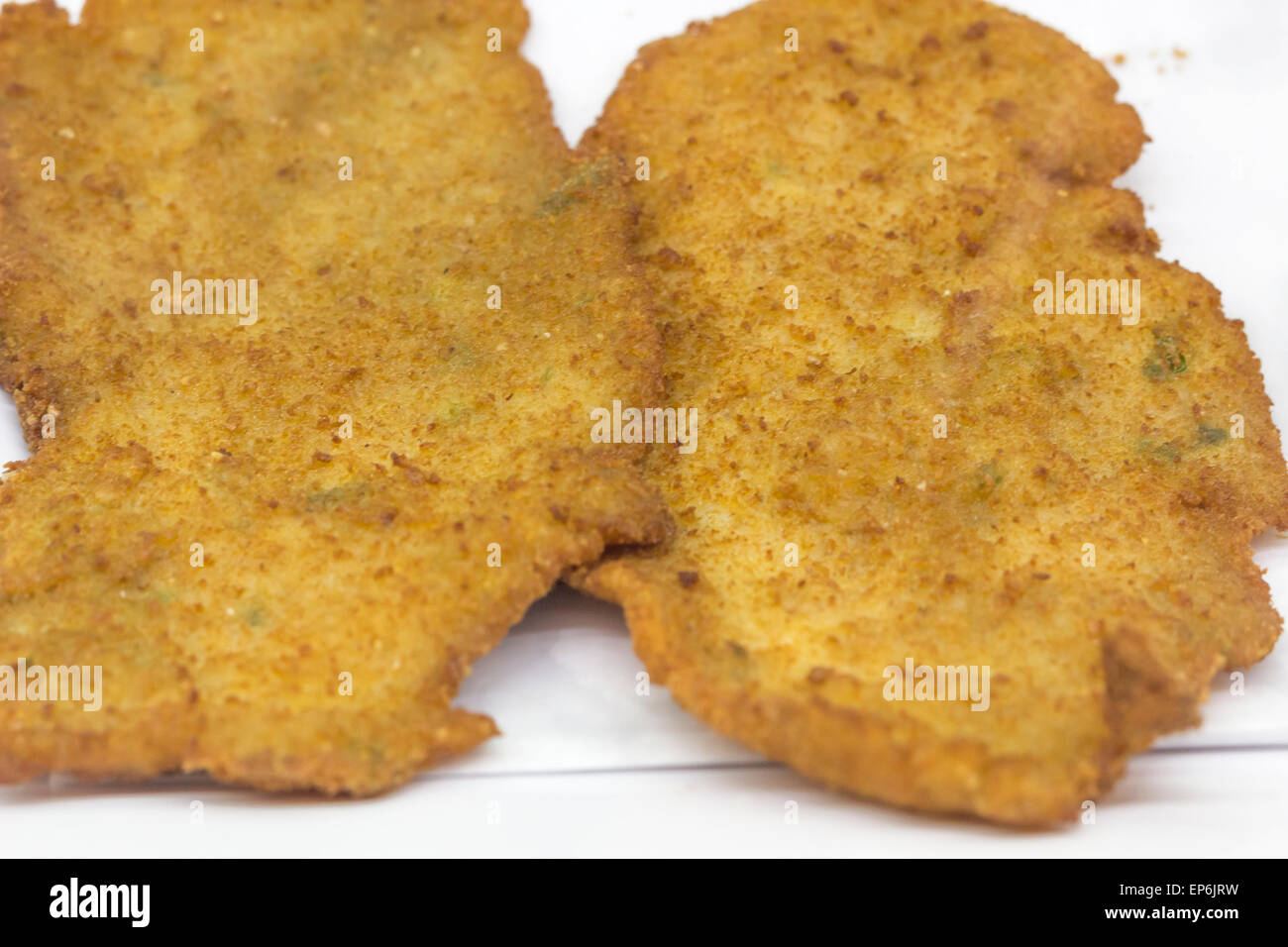 Breaded fried chicken cutlets on platter on display at restauant Stock ...