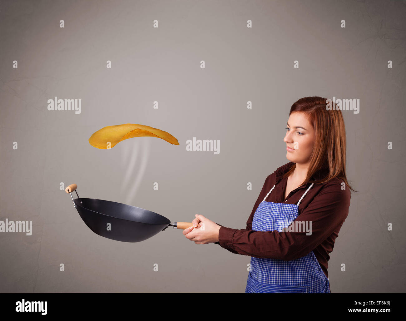 Woman making pancakes Stock Photo - Alamy