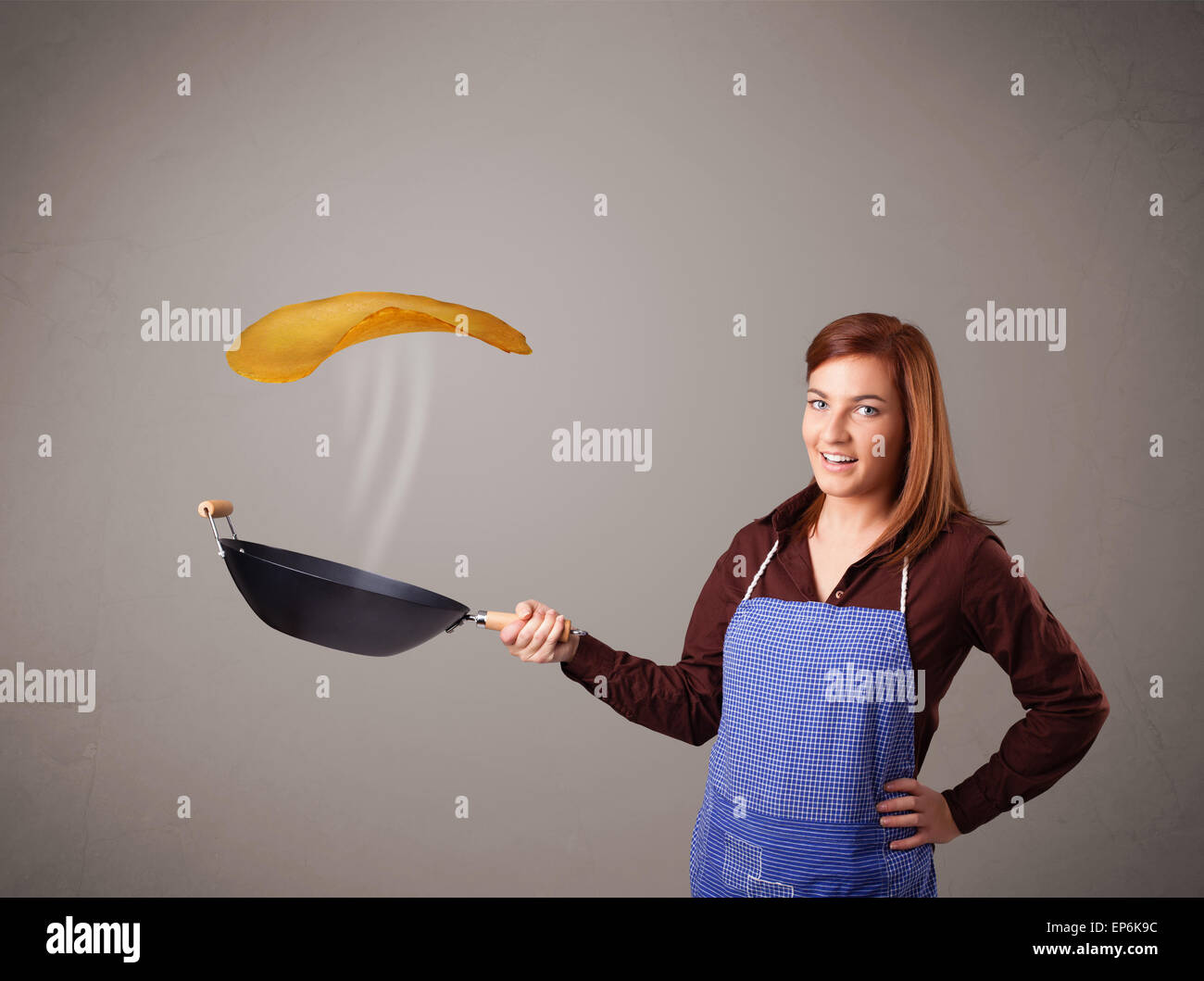 Woman tossing pancakes hi-res stock photography and images - Alamy