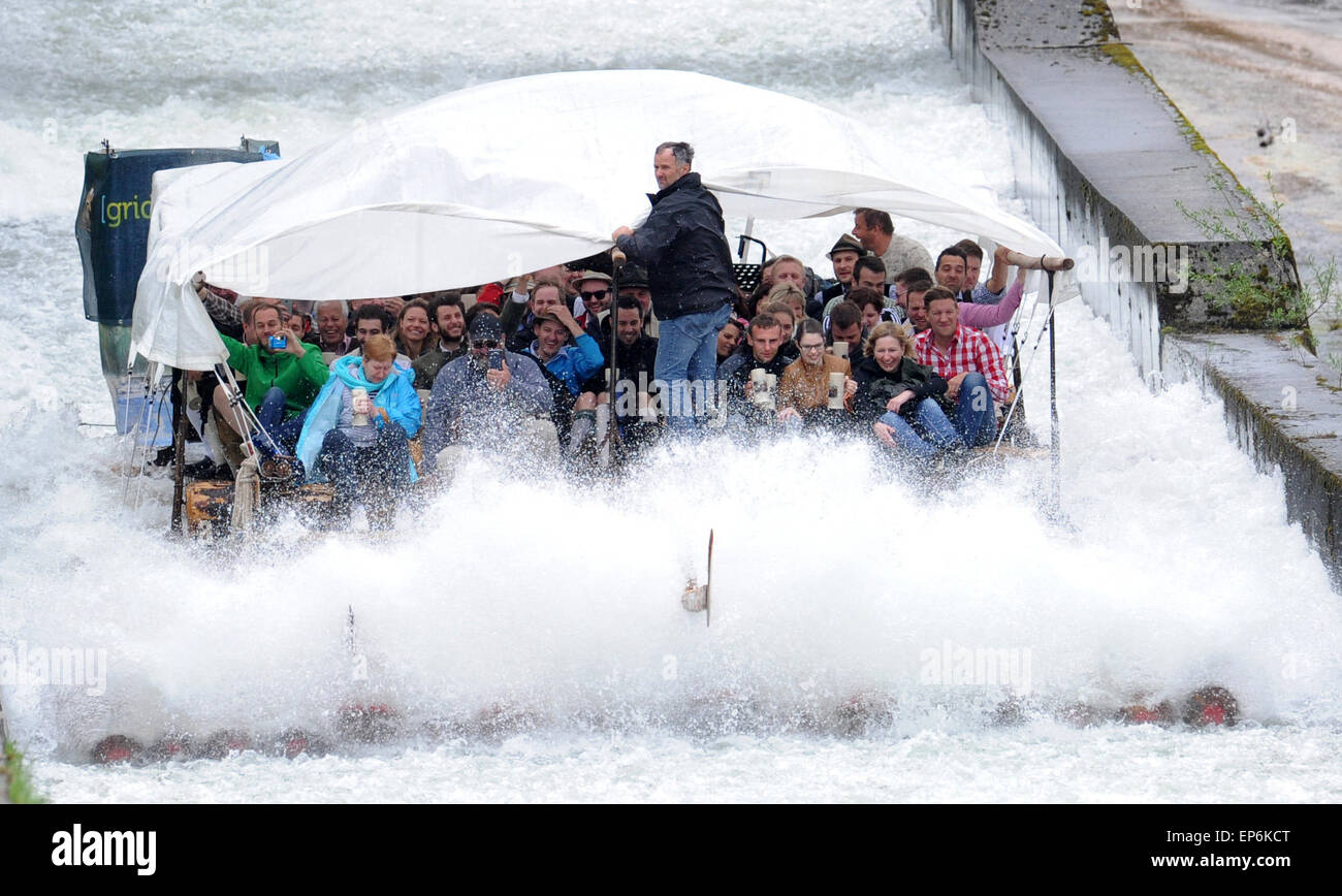 A group of day-trippers ride down the raft chute during a raft ride on ...