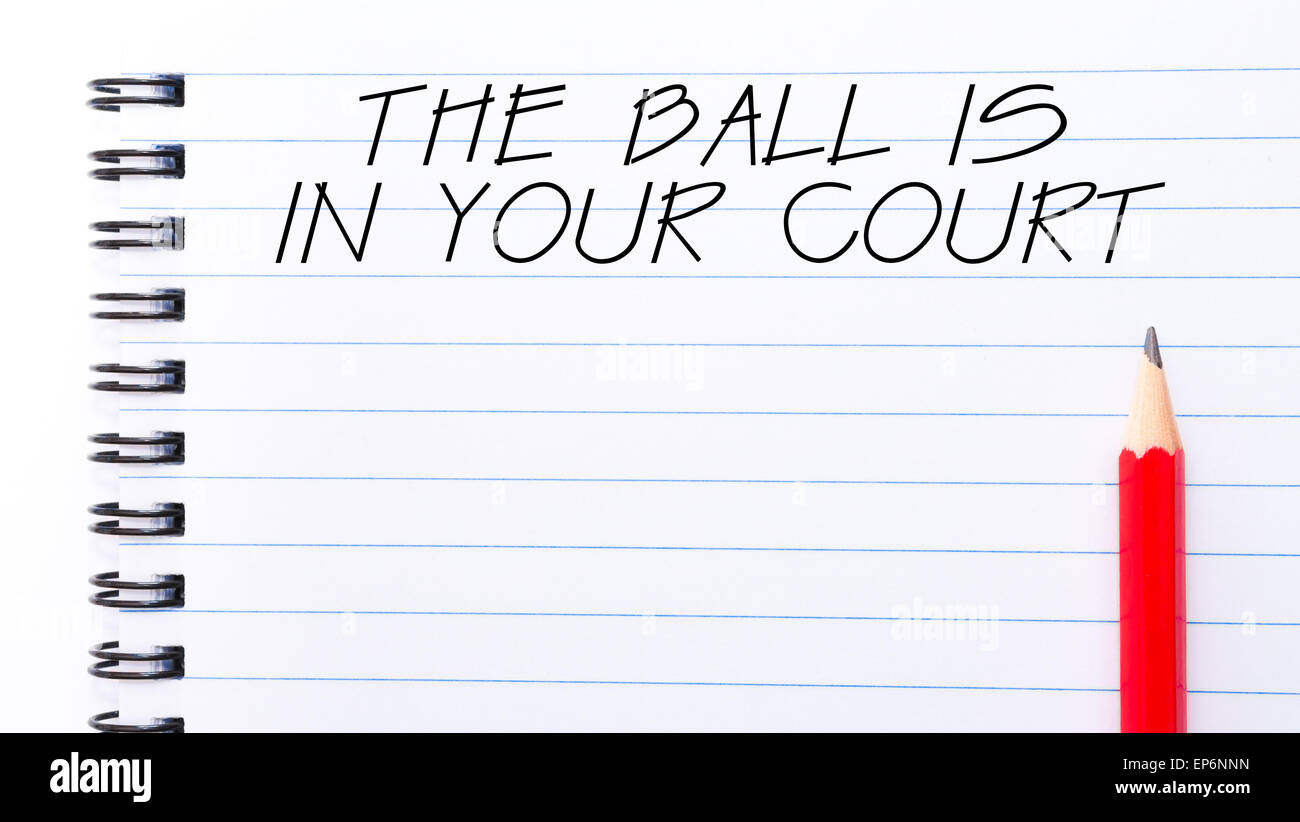 The Ball Is In Your Court Text written on notebook page, red pencil on ...