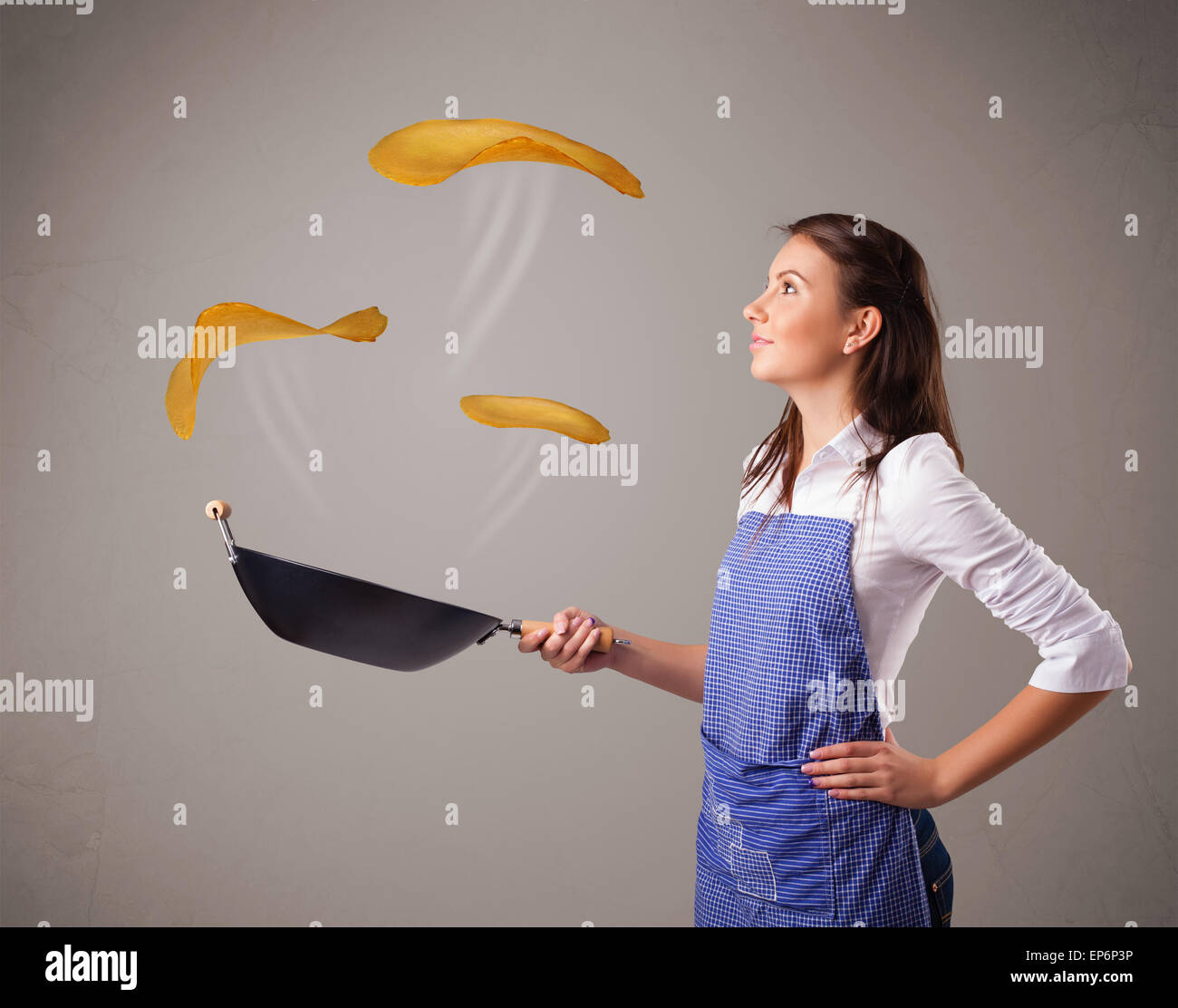 Woman making pancakes Stock Photo - Alamy