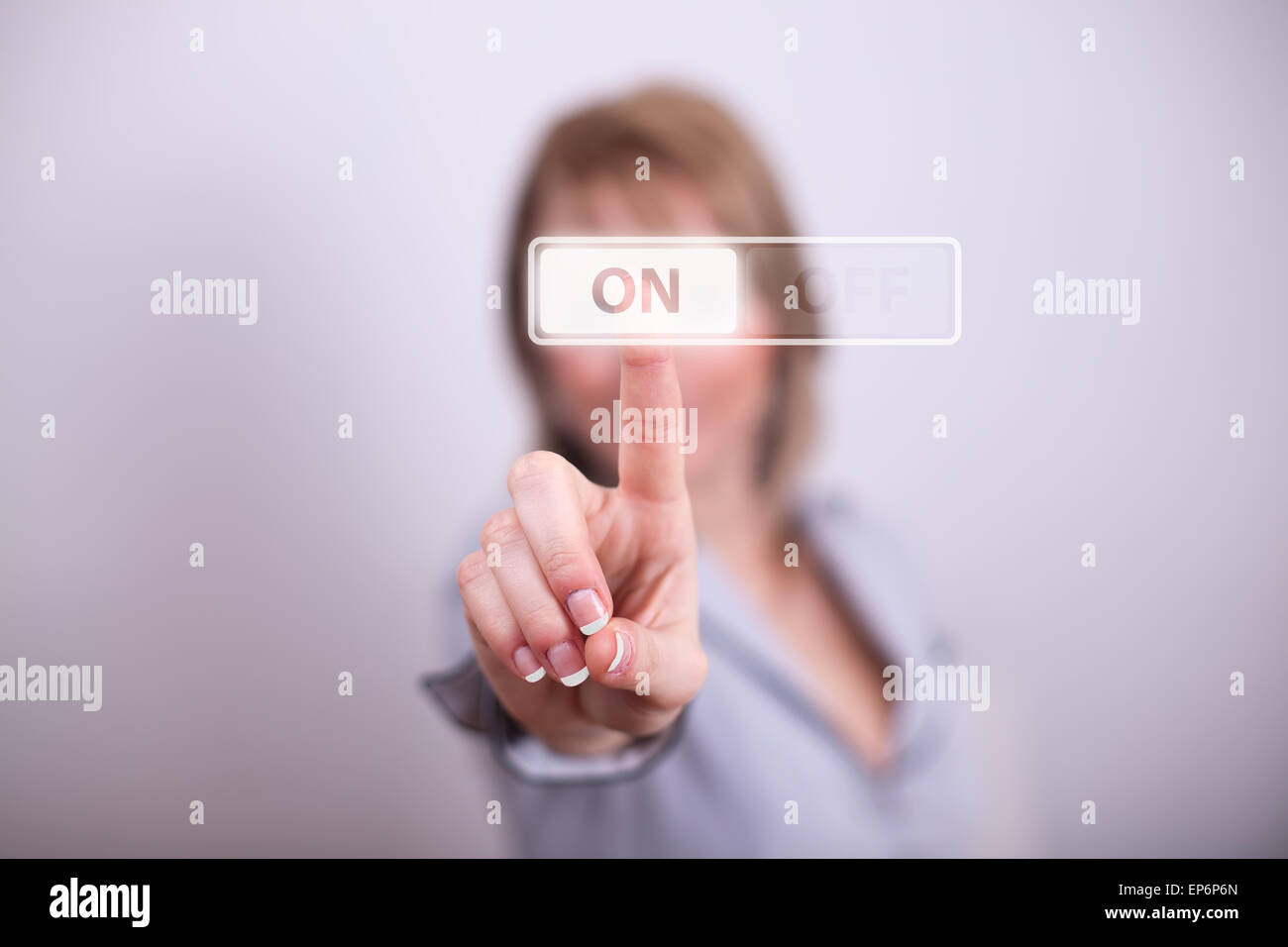 Woman pressing on off button Stock Photo - Alamy