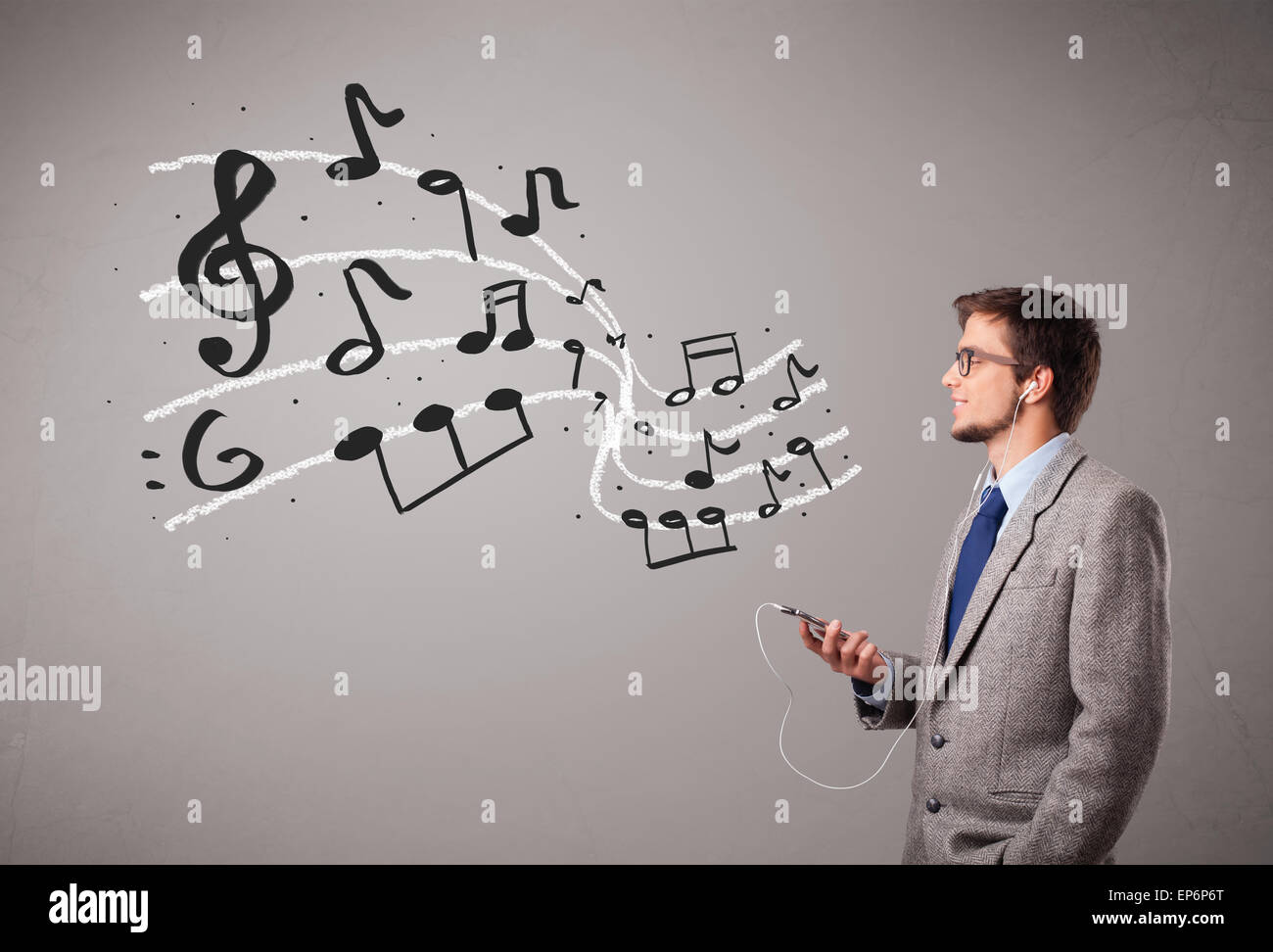 handsome boy singing and listening to music with musical notes Stock ...