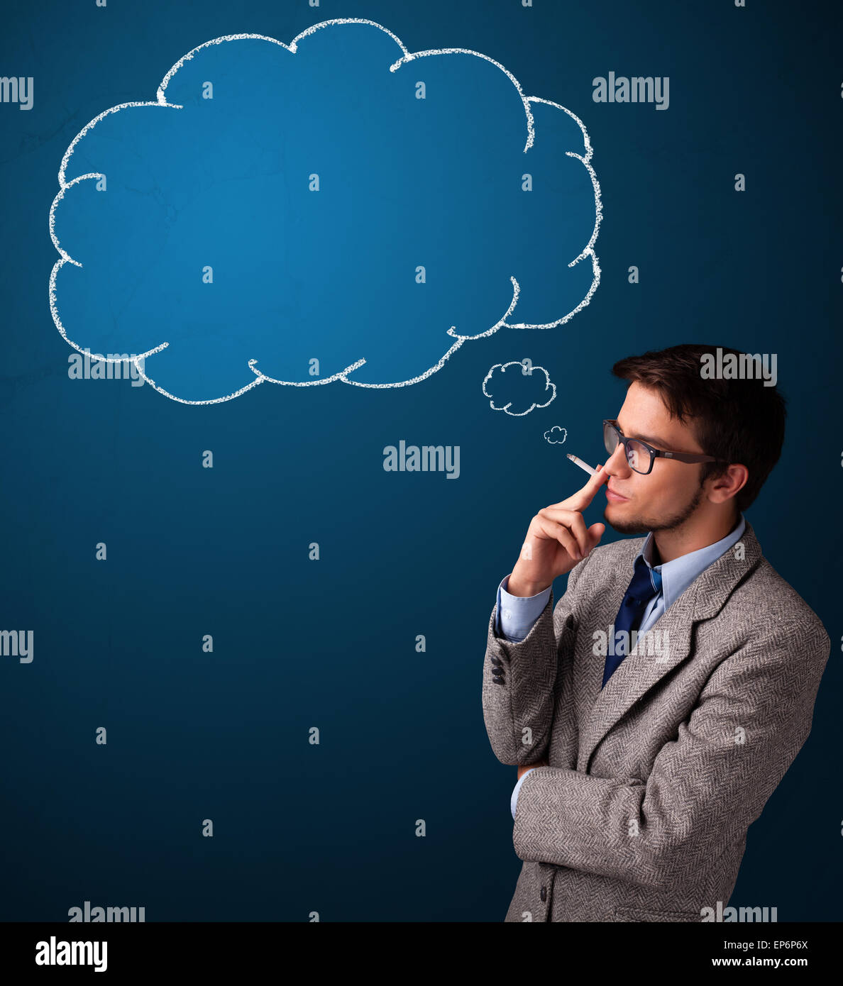Young man smoking cigarette with idea cloud Stock Photo - Alamy