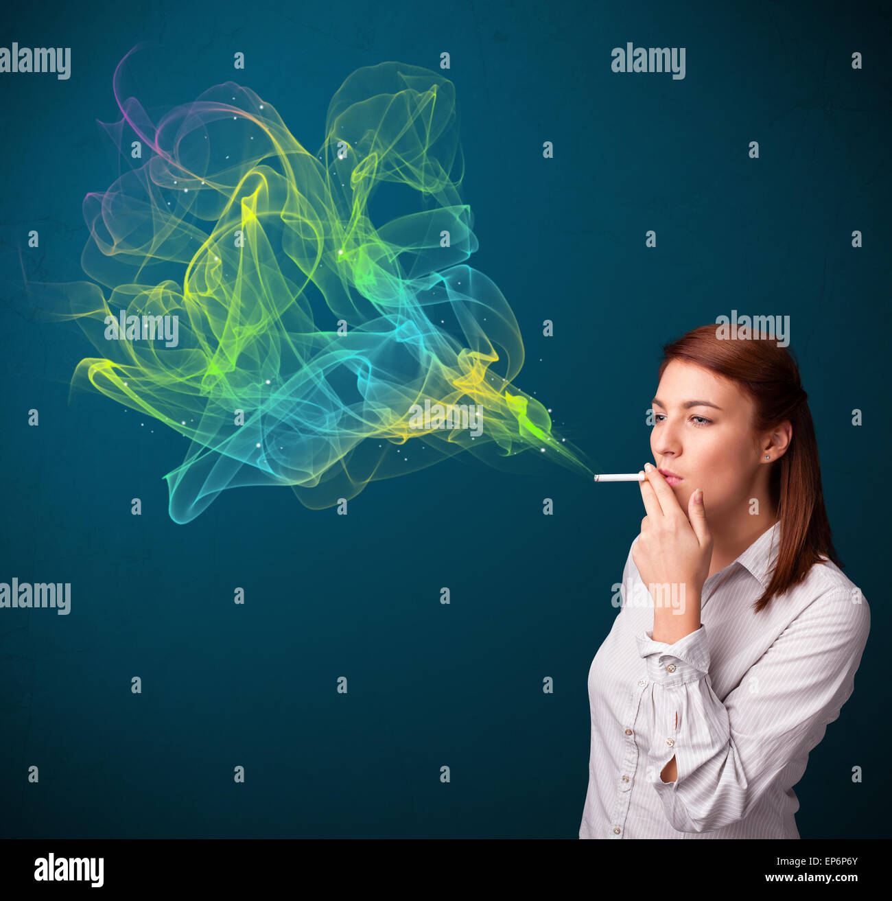 Pretty lady smoking cigarette with colorful smoke Stock Photo - Alamy