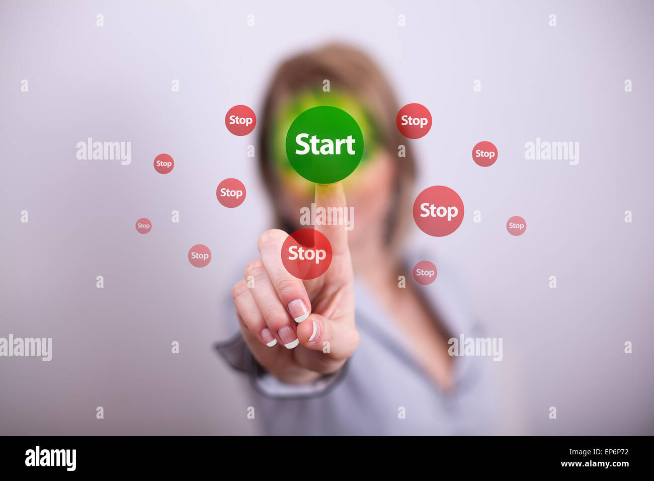 Woman pressing start button Stock Photo - Alamy