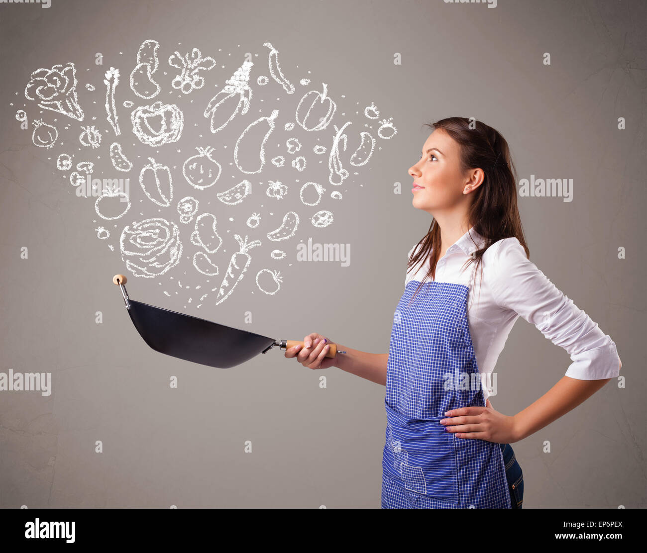 Woman cooking vegetables Stock Photo - Alamy