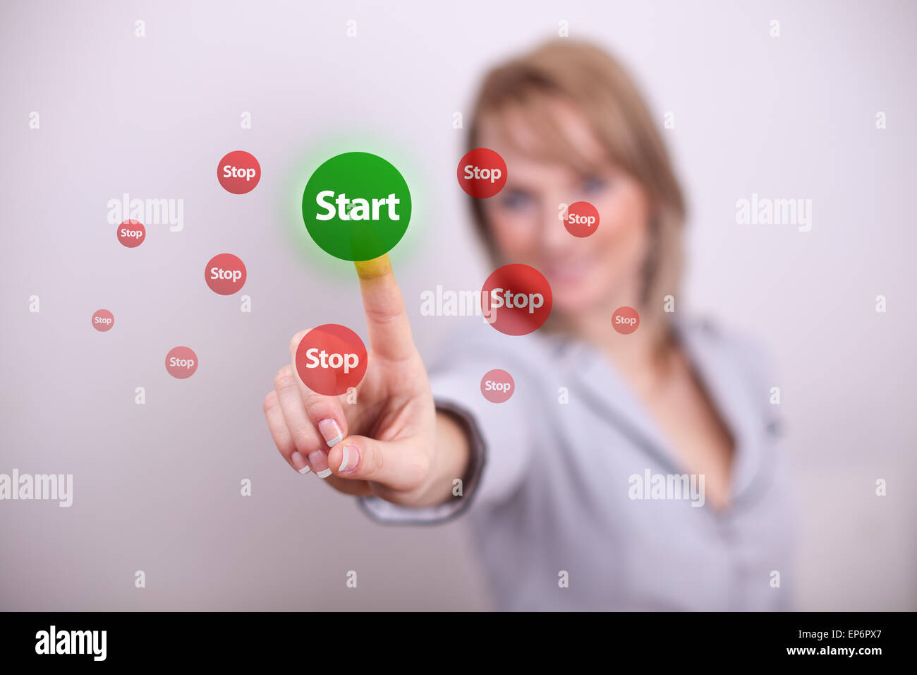 Woman pressing start and stop button Stock Photo - Alamy
