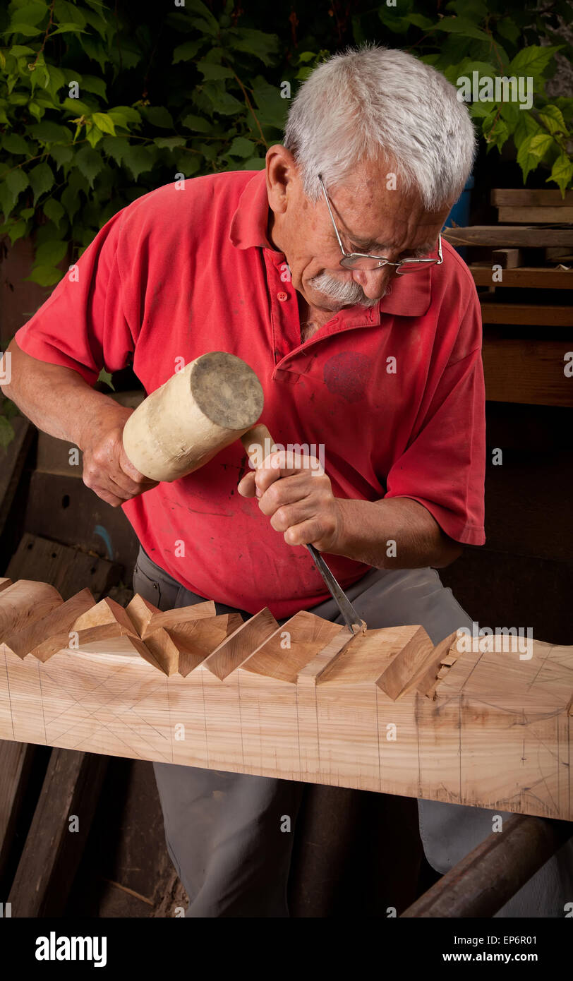 woodcarver working with mallet and chisel Stock Photo - Alamy