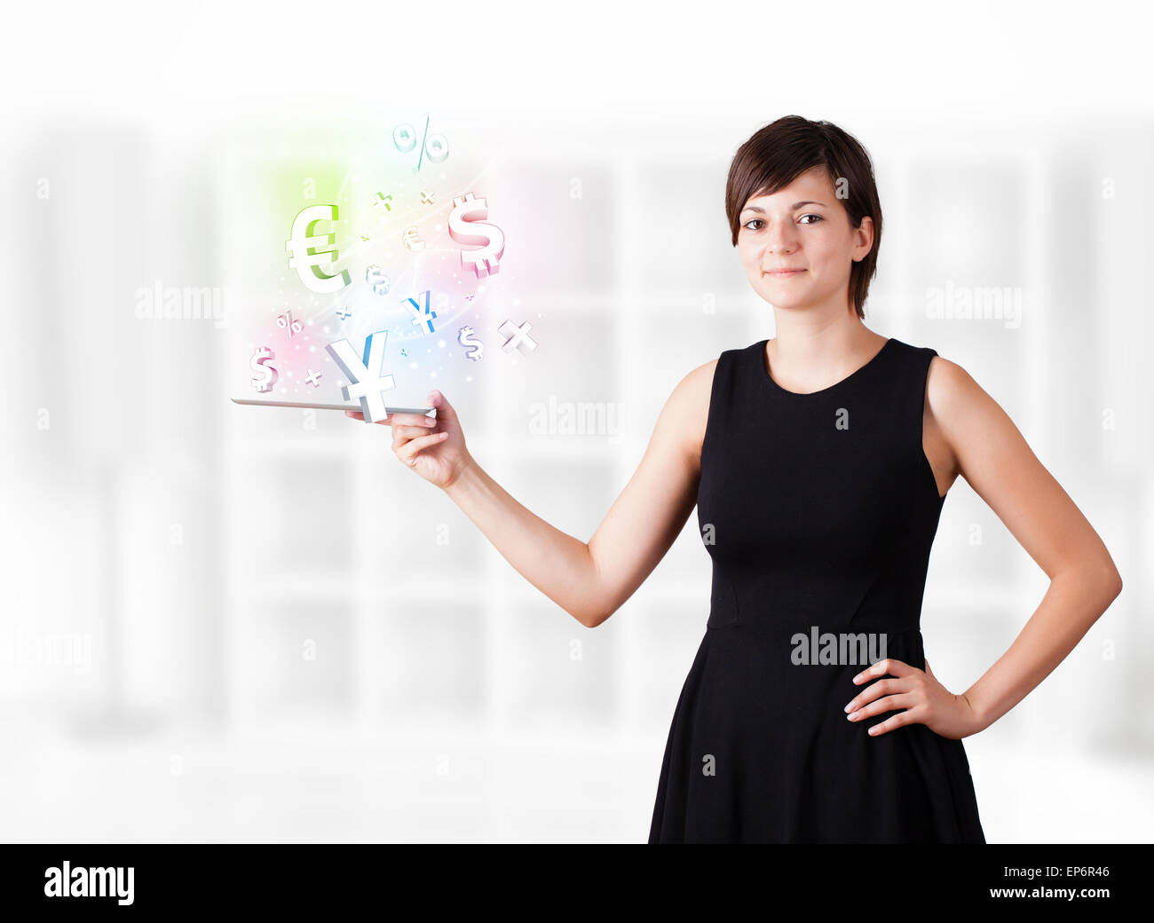 Young woman looking at modern tablet with currency icons Stock Photo ...