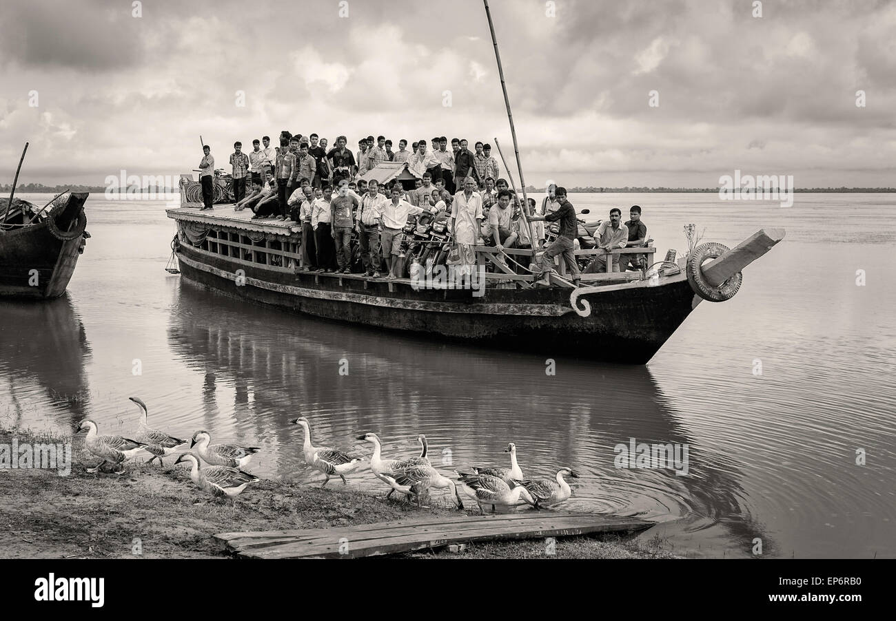 Overcrowded public ferry arrives at Nimati Ghat from Majuli Island ...