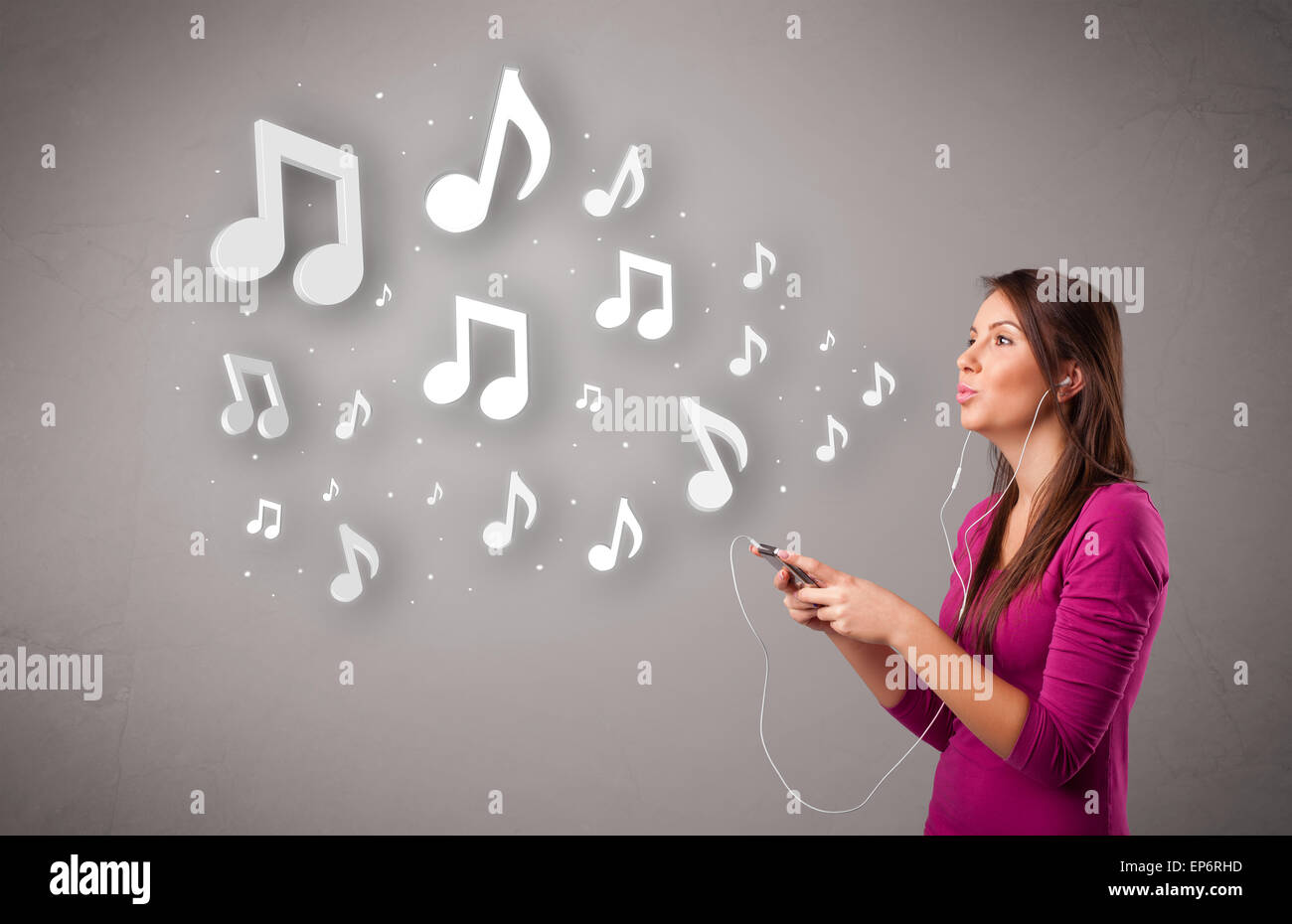 Pretty young woman singing and listening to music with musical notes ...