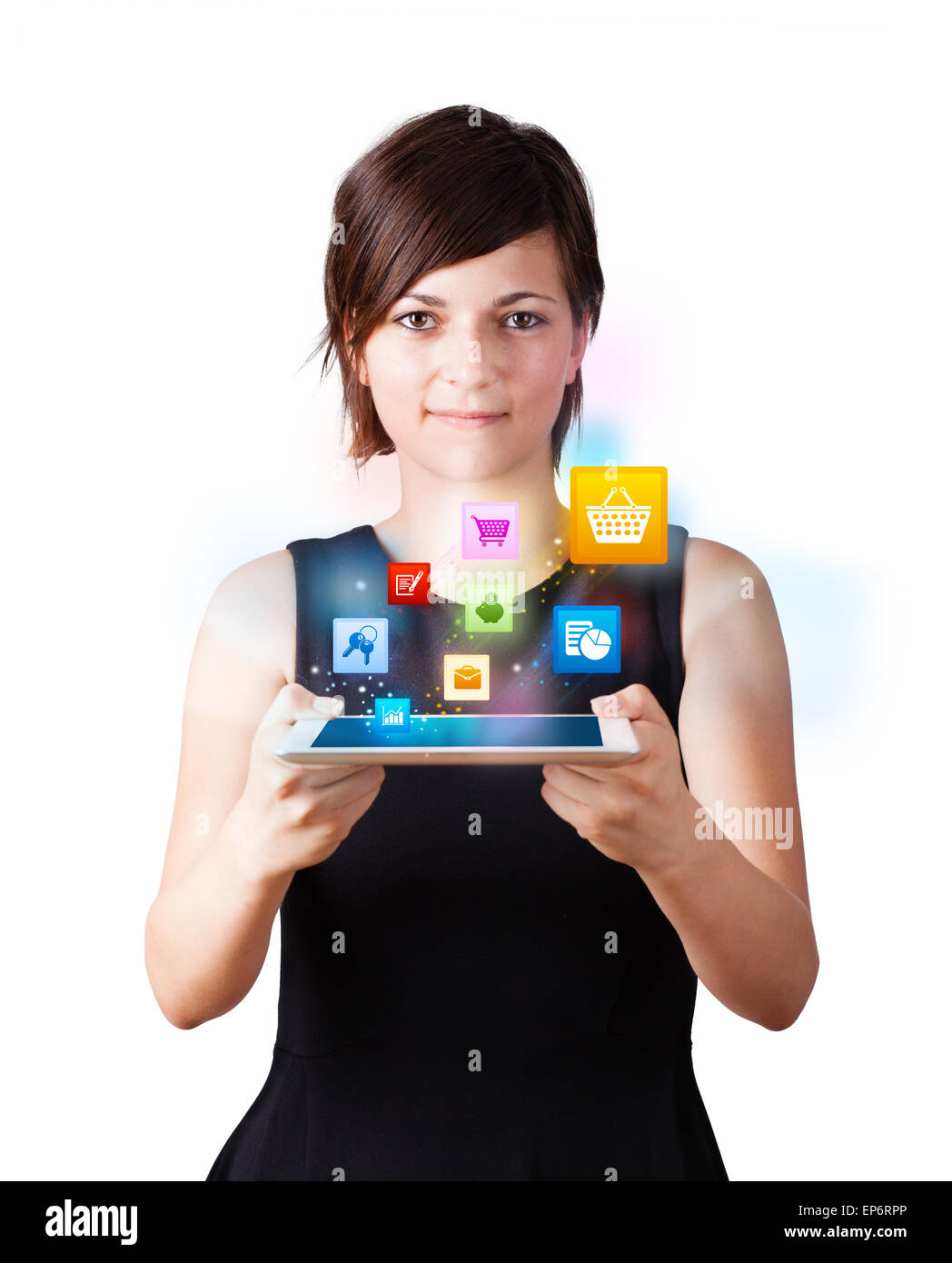 Young woman looking at modern tablet with colourful icons Stock Photo ...