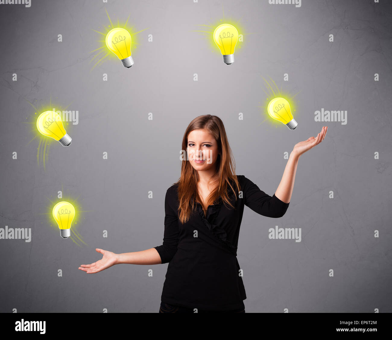 young lady standing and juggling with light bulbs Stock Photo - Alamy