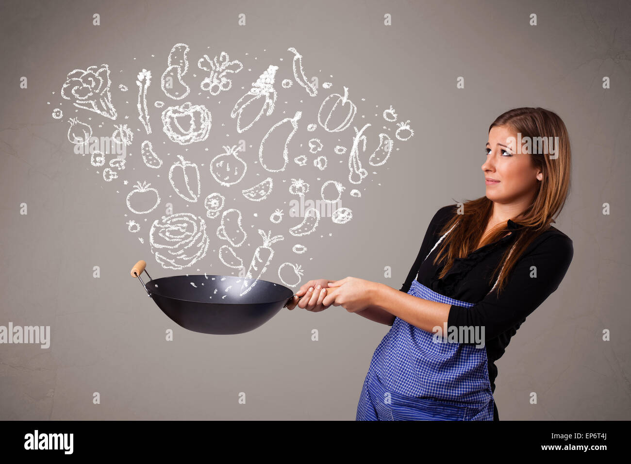 Woman cooking vegetables Stock Photo - Alamy