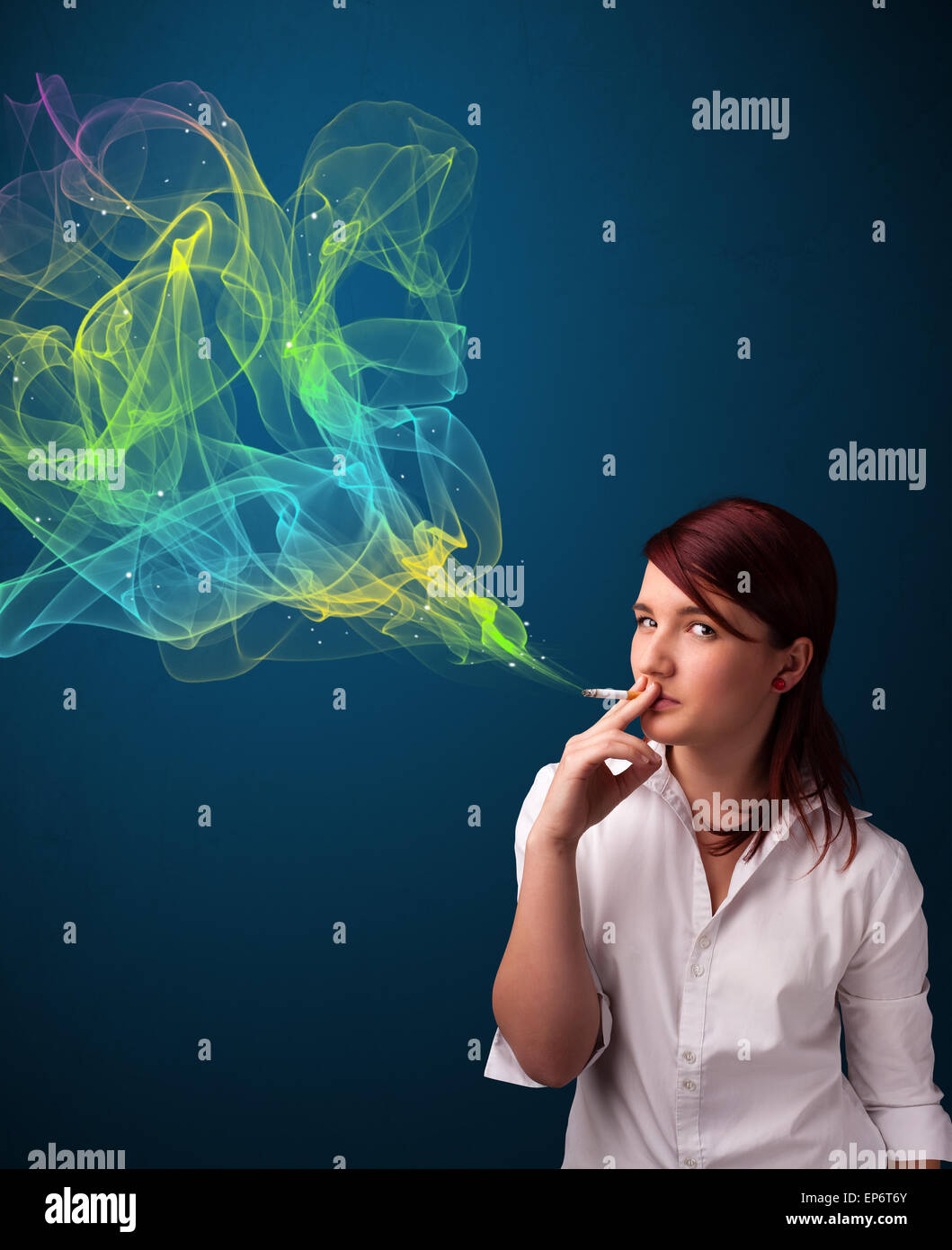 Pretty lady smoking cigarette with colorful smoke Stock Photo - Alamy