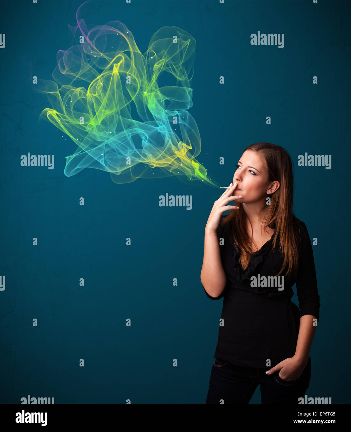 Pretty lady smoking cigarette with colorful smoke Stock Photo - Alamy
