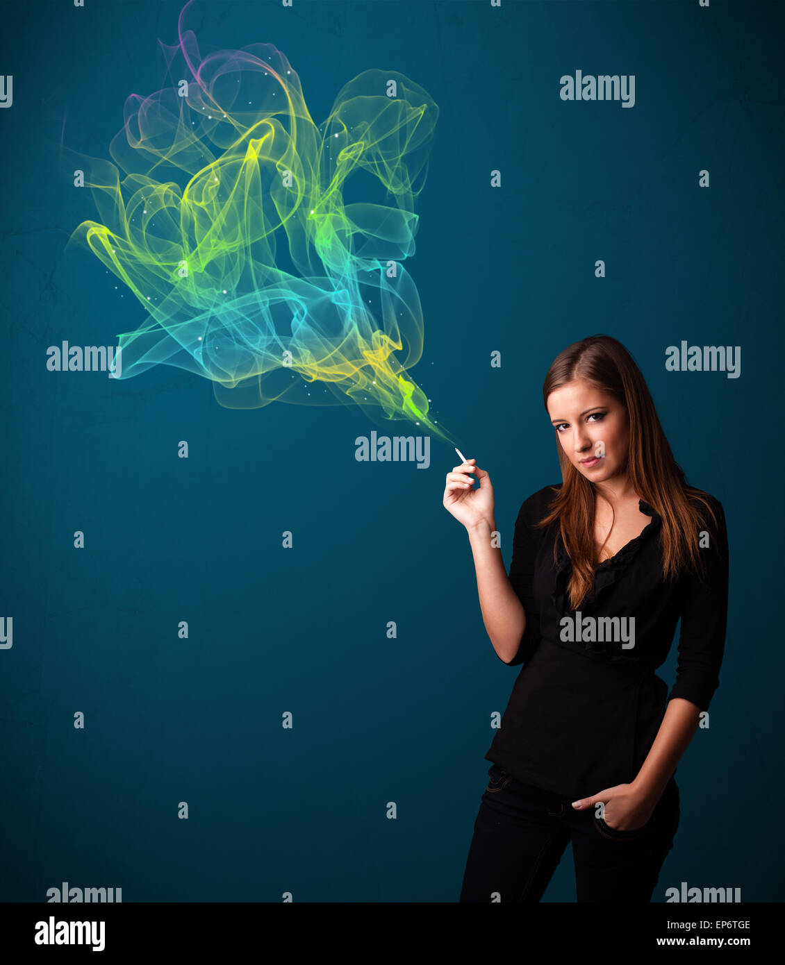 Pretty lady smoking cigarette with colorful smoke Stock Photo - Alamy