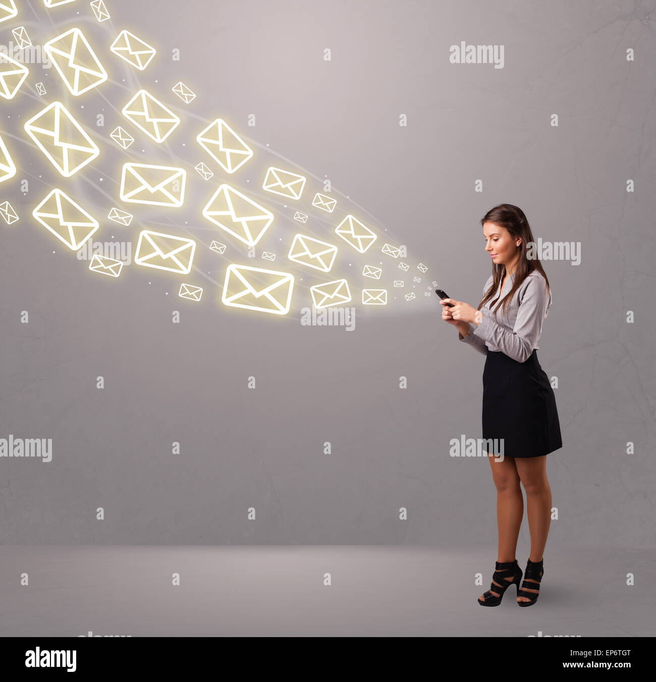 attractive young lady holding a phone with message icons Stock Photo ...