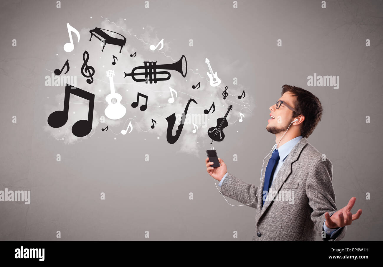 attractive young man singing and listening to music with musical notes ...