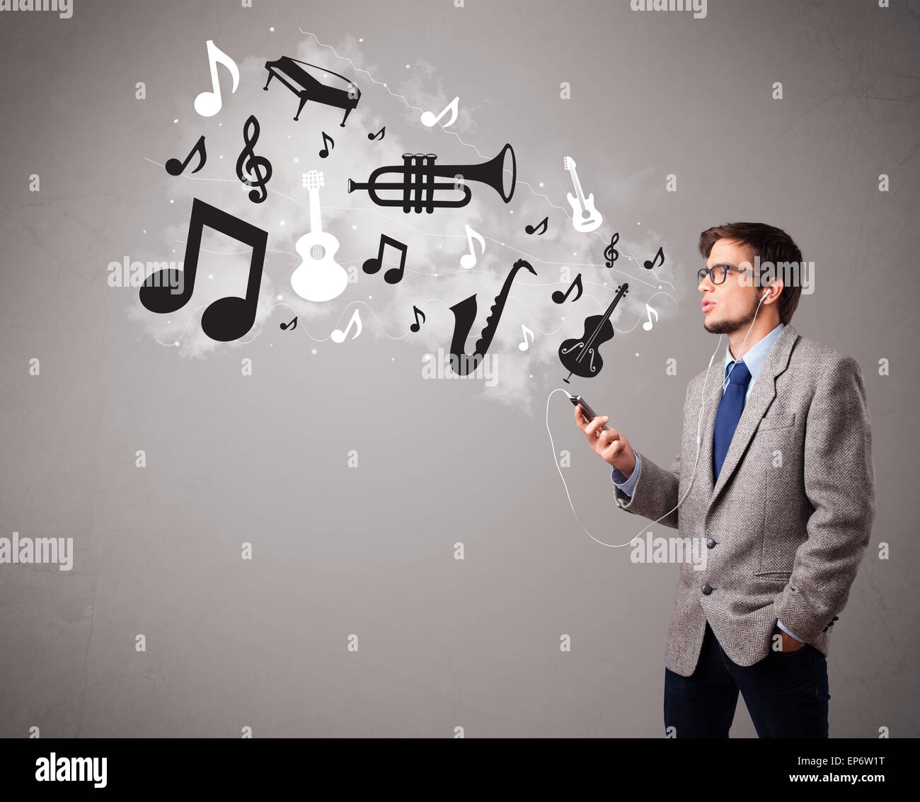 attractive young man singing and listening to music with musical notes ...