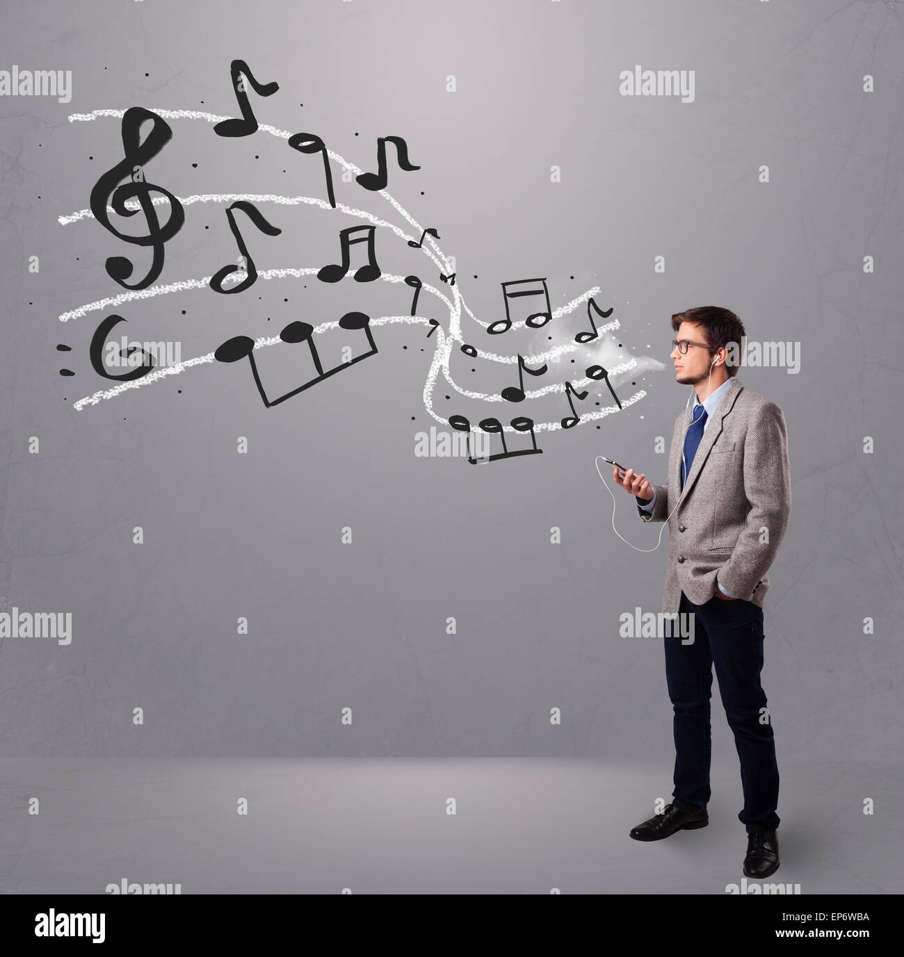 handsome boy singing and listening to music with musical notes Stock ...