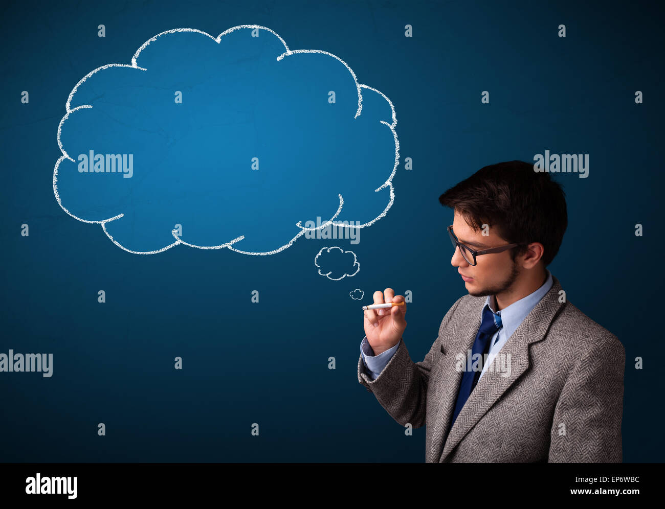 Young man smoking cigarette with idea cloud Stock Photo - Alamy