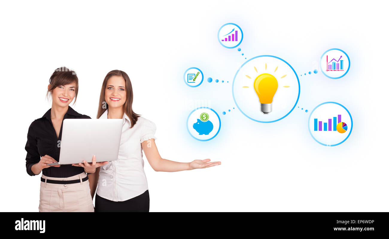 beautiful young women presenting light bulb with colorful graphs and ...