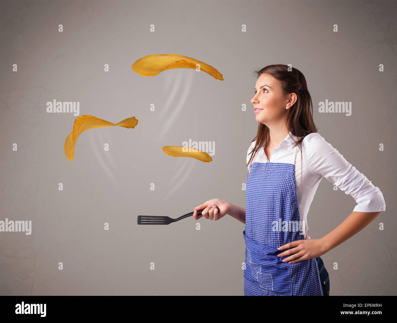 Woman making pancakes Stock Photo - Alamy