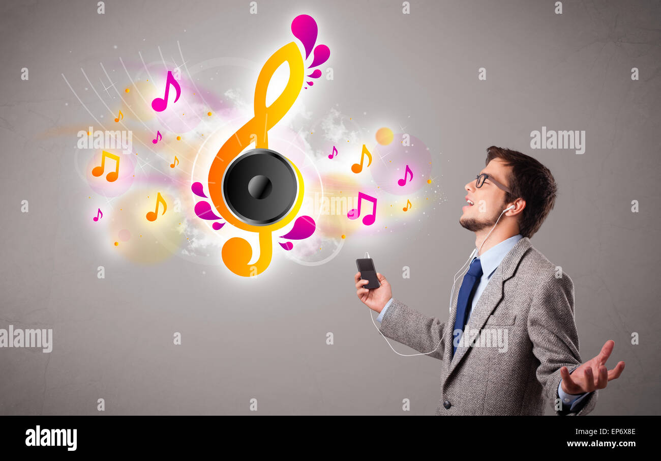 young man singing and listening to music with musical notes Stock Photo ...