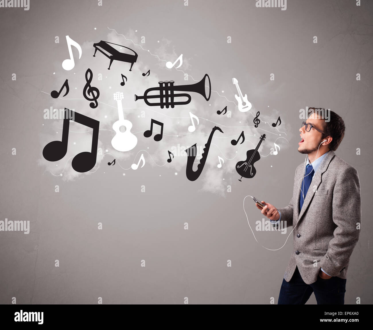 attractive young man singing and listening to music with musical notes ...