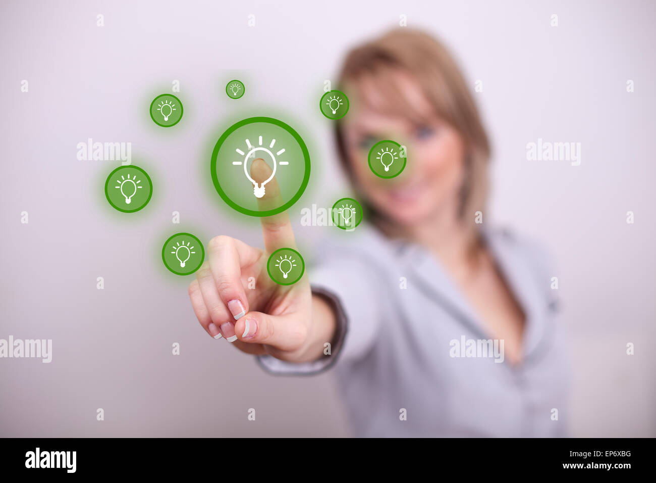 Woman pressing idea button with one hand Stock Photo - Alamy