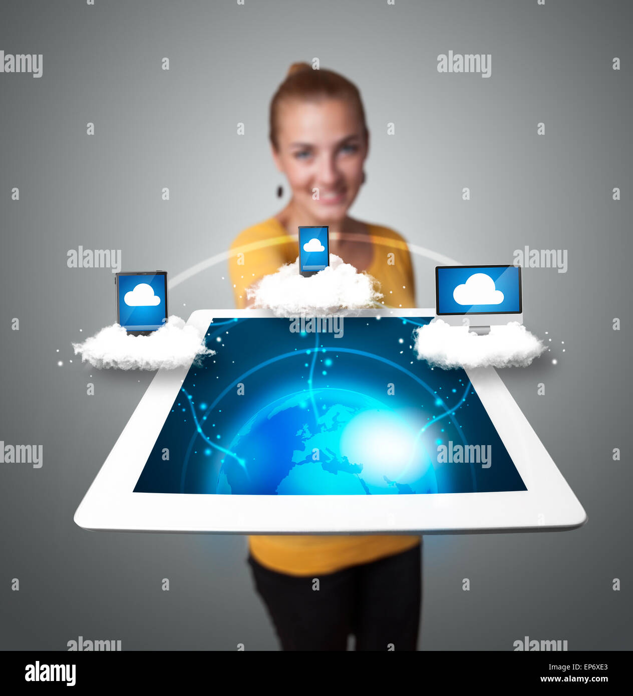 Young woman holding tablet with modern devices Stock Photo - Alamy