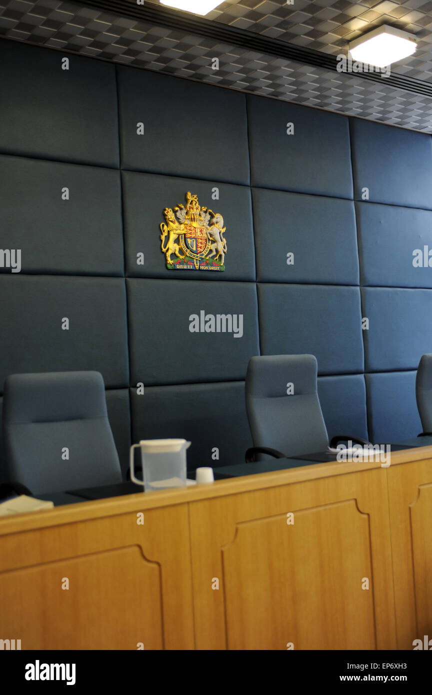 Seats where magistrates site, behind them is The Royal Coat of Arms of ...