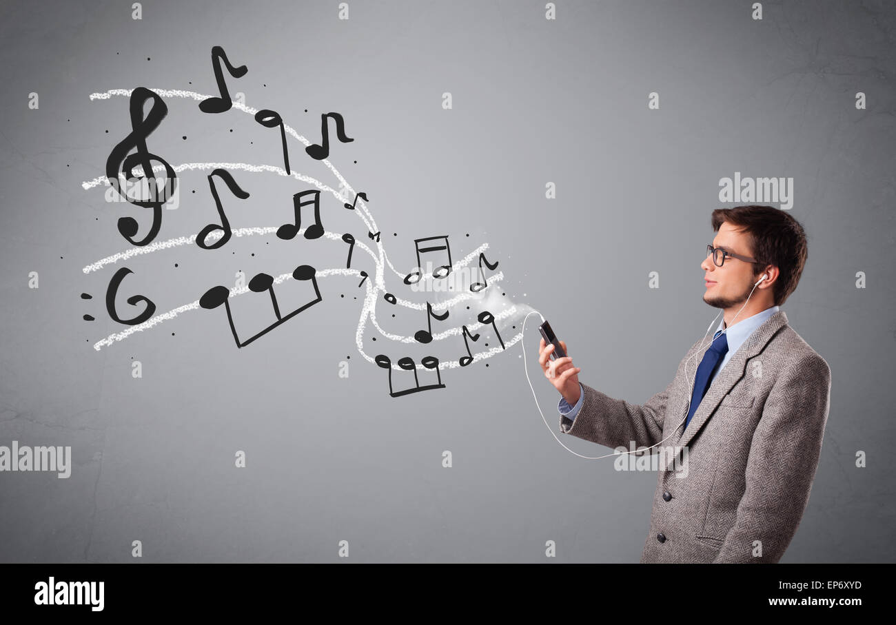 handsome boy singing and listening to music with musical notes Stock ...