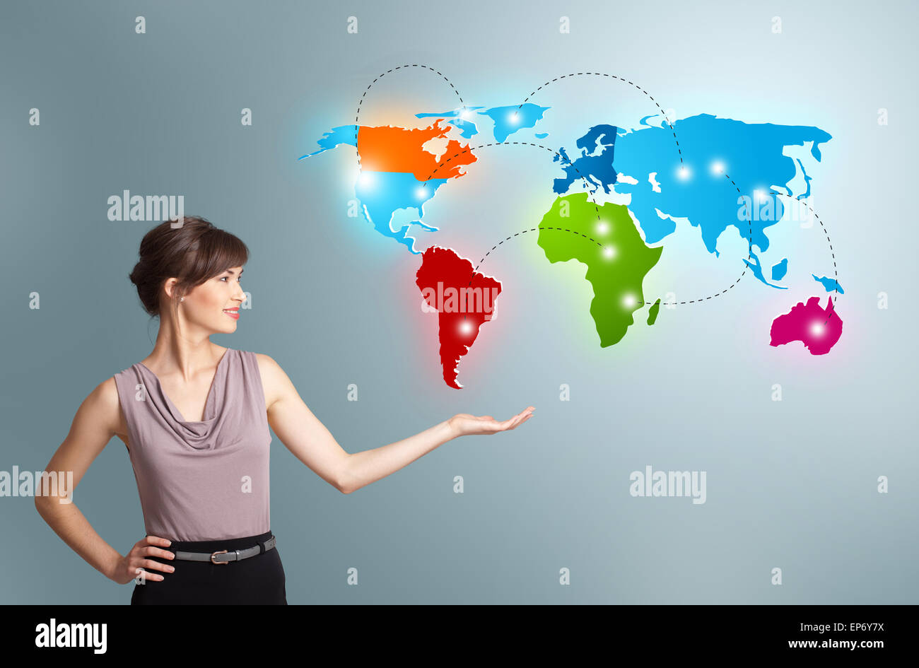 Young woman presenting colorful world map Stock Photo - Alamy
