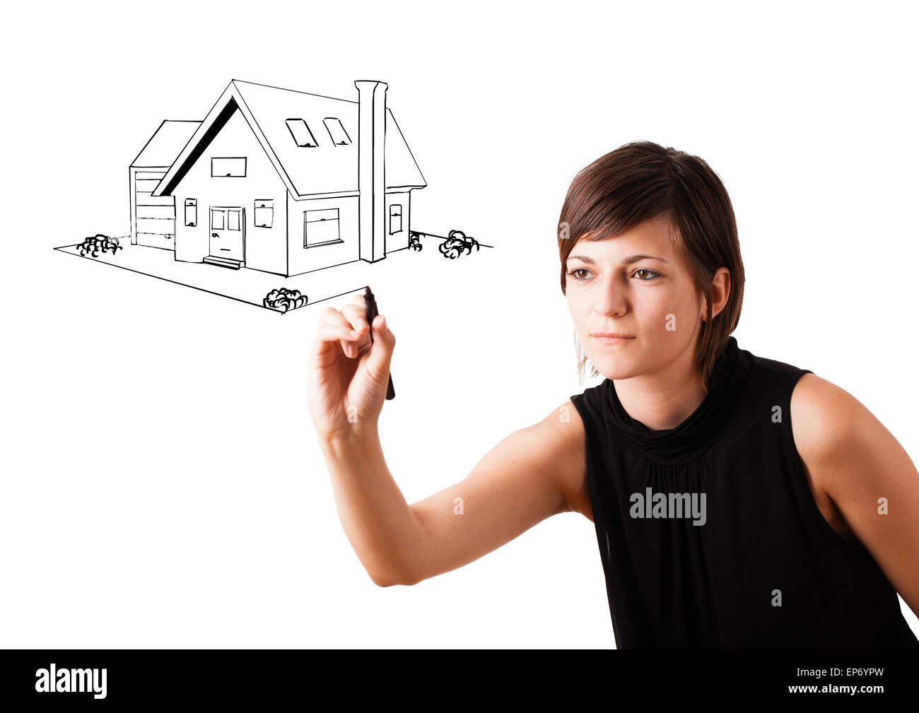 Young woman drawing a house on whiteboard Stock Photo - Alamy