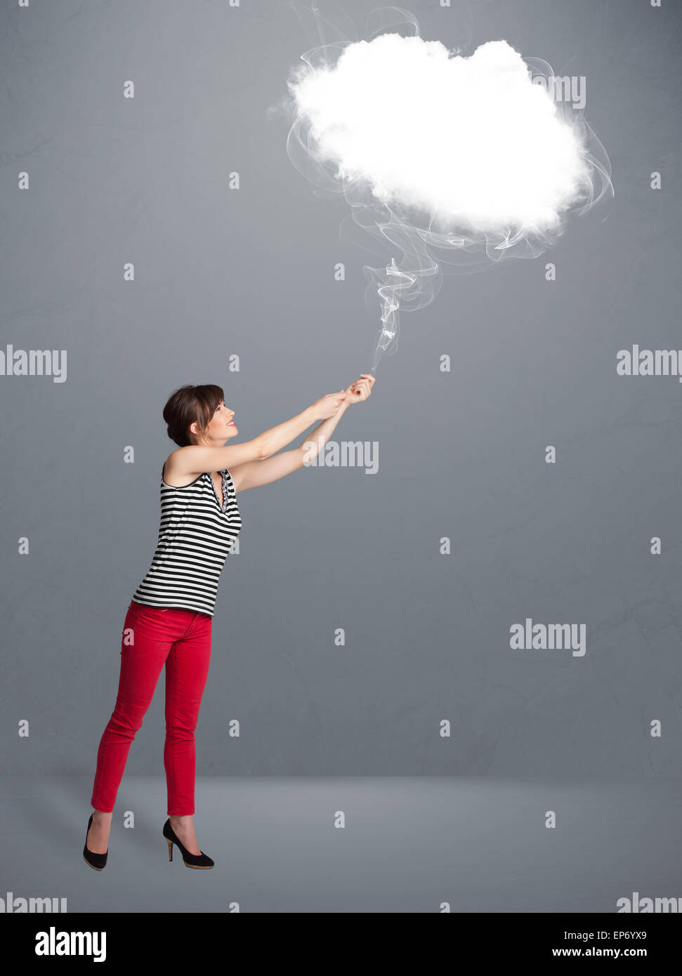 Beautiful lady holding cloud Stock Photo - Alamy