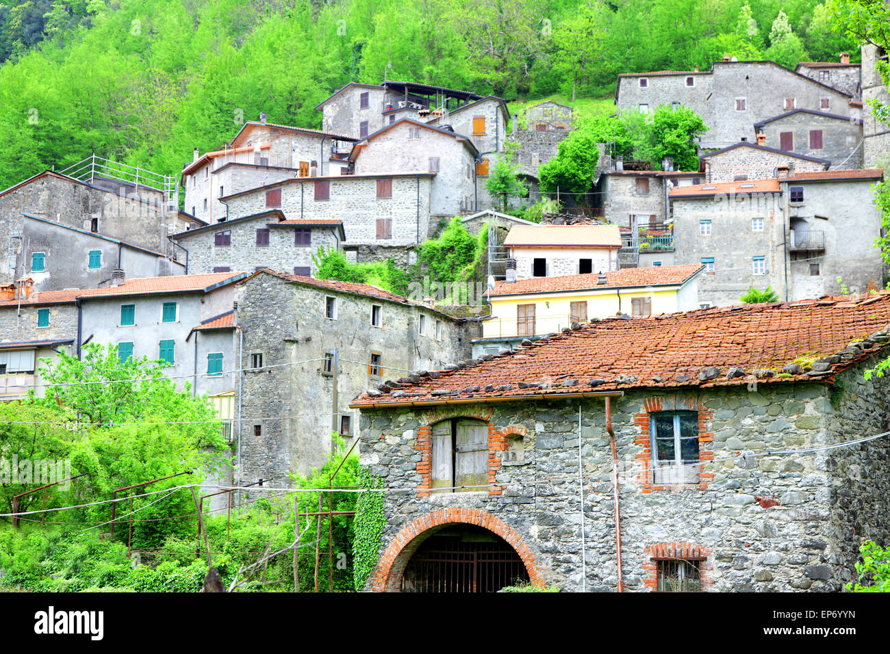 very small medieval italian village far in mountains Stock Photo - Alamy