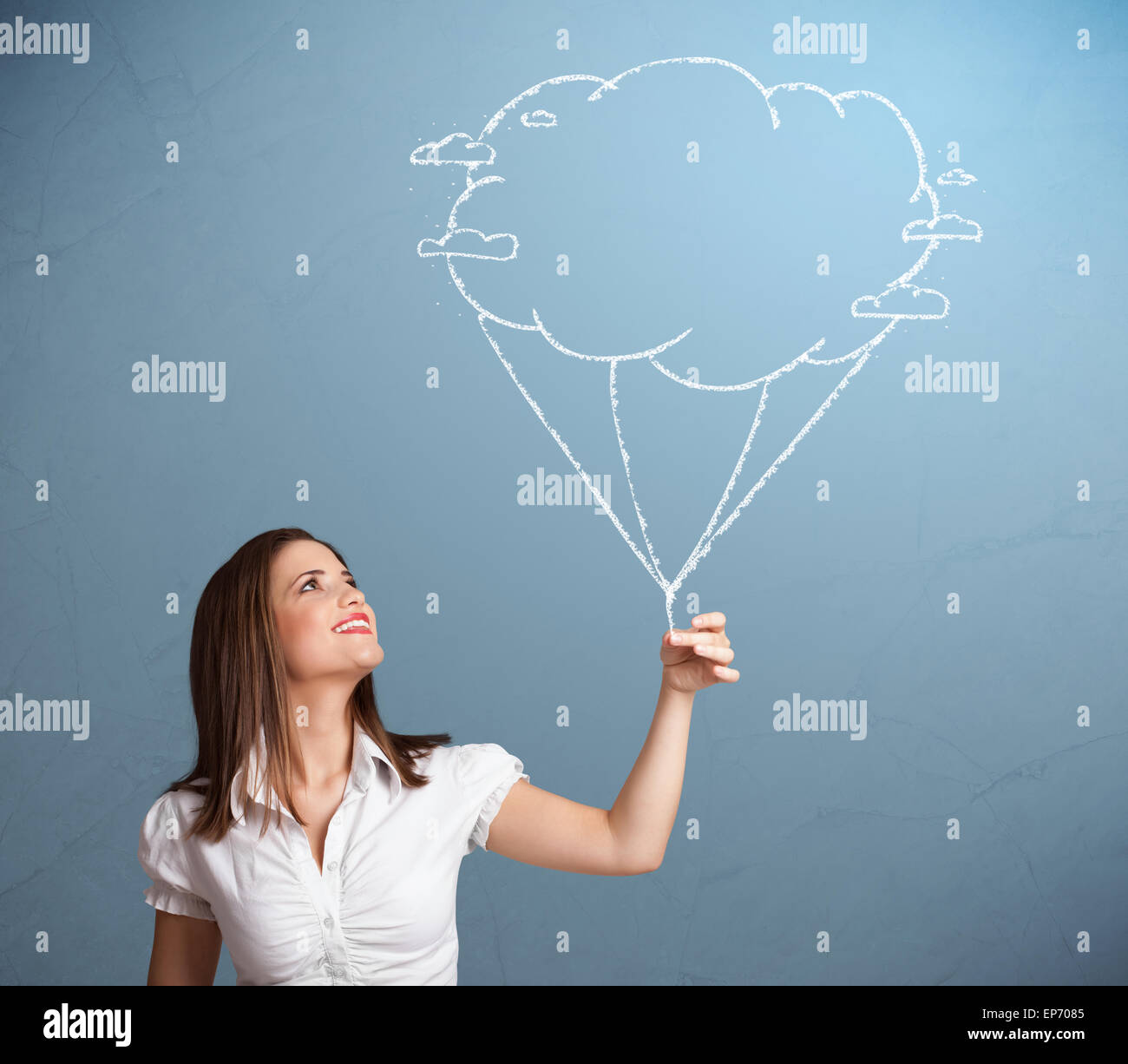 Pretty lady holding a cloud balloon drawing Stock Photo - Alamy