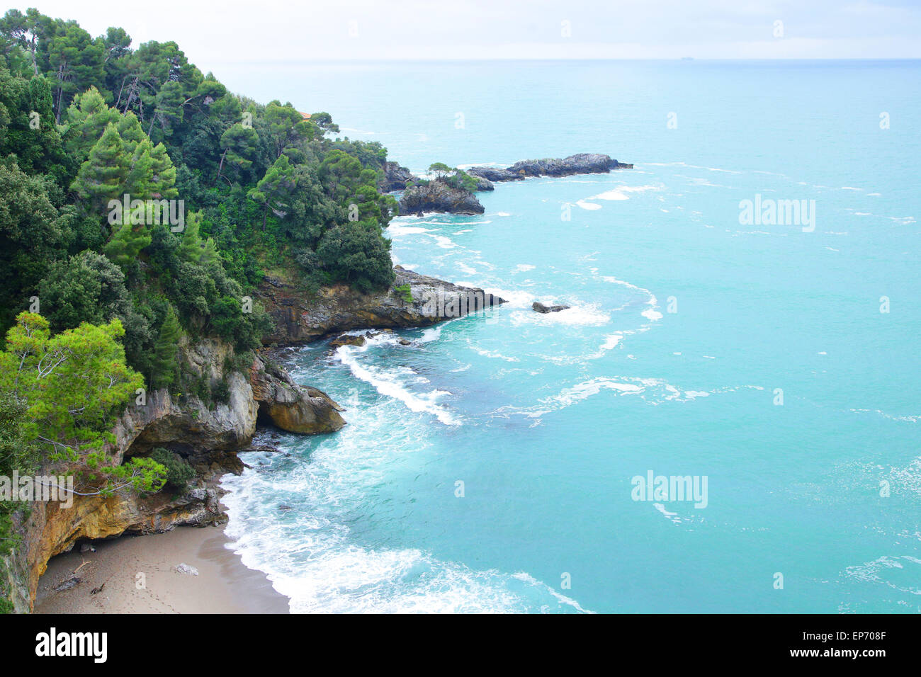 wild italian beach with sand and rocks caves Stock Photo - Alamy