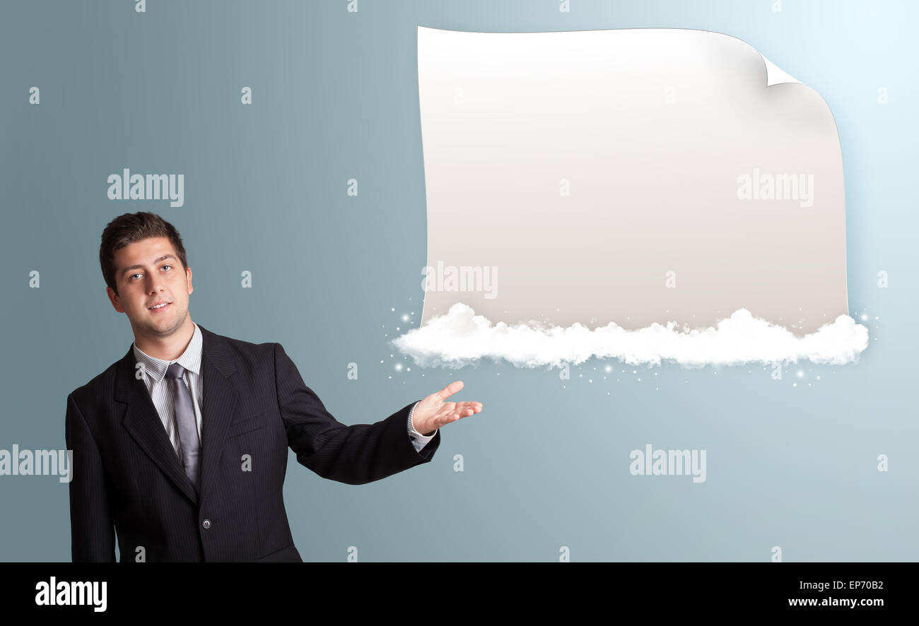 attractive man presenting modern copy space on clouds Stock Photo - Alamy