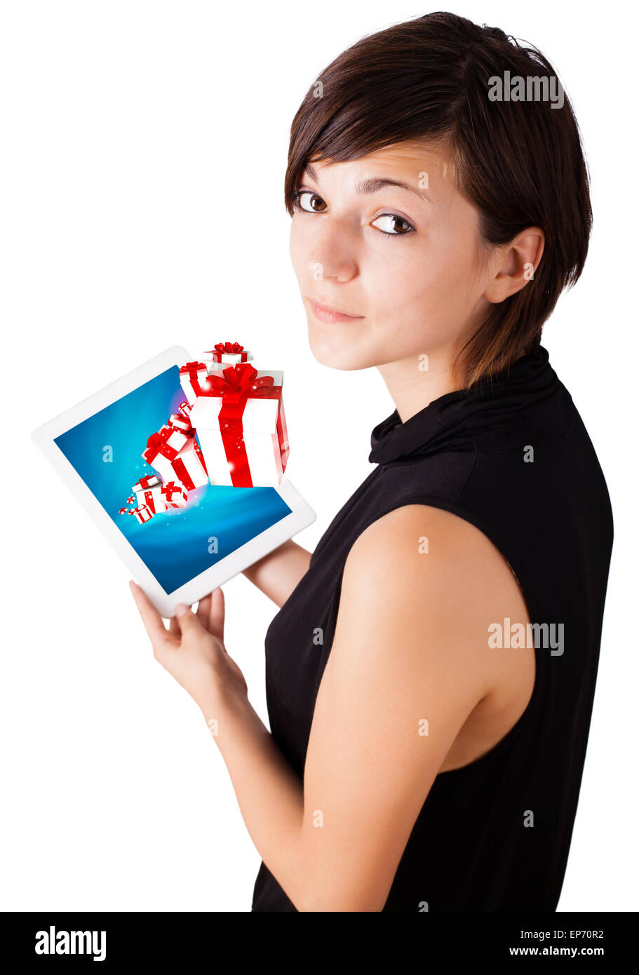 Young woman looking at modern tablet with present boxes Stock Photo - Alamy