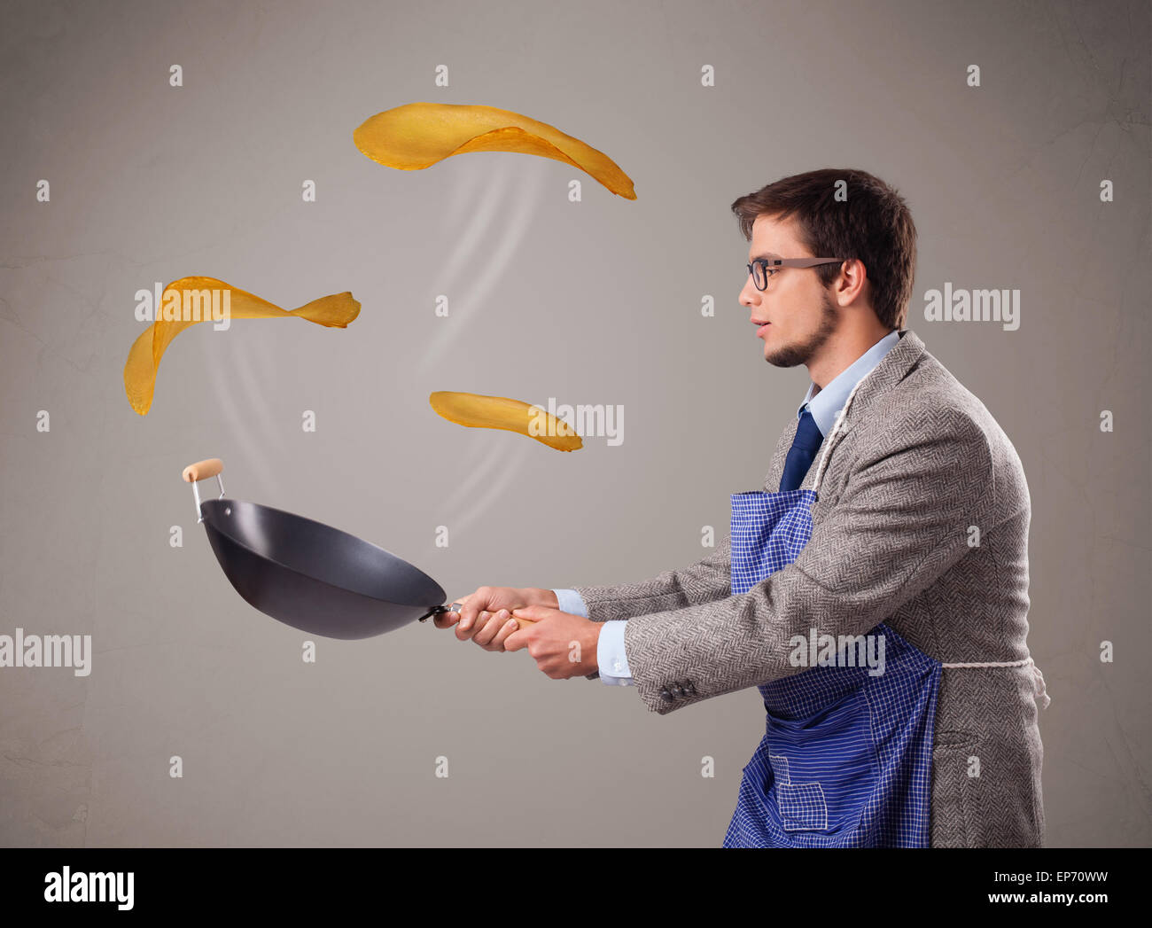 Boy making pancakes Stock Photo - Alamy