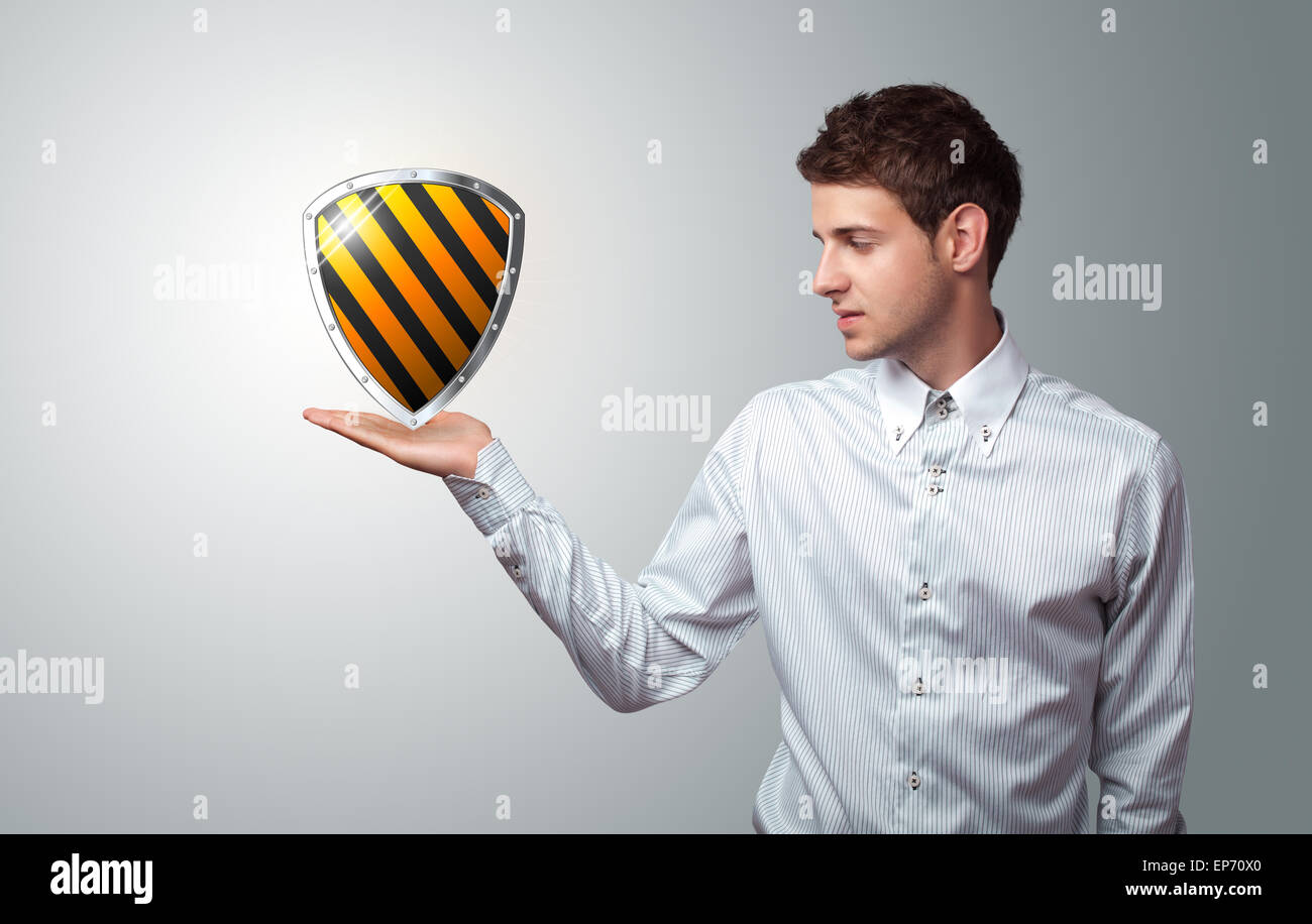 businessman holding virtual shield sign Stock Photo - Alamy