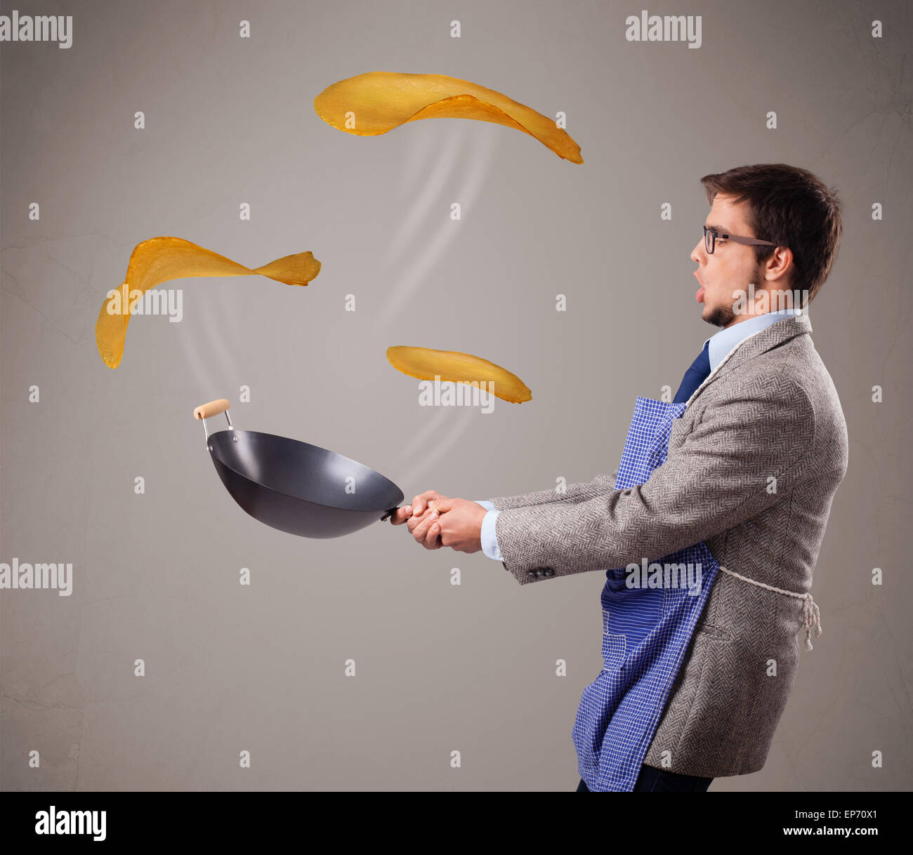 Boy making pancakes Stock Photo - Alamy