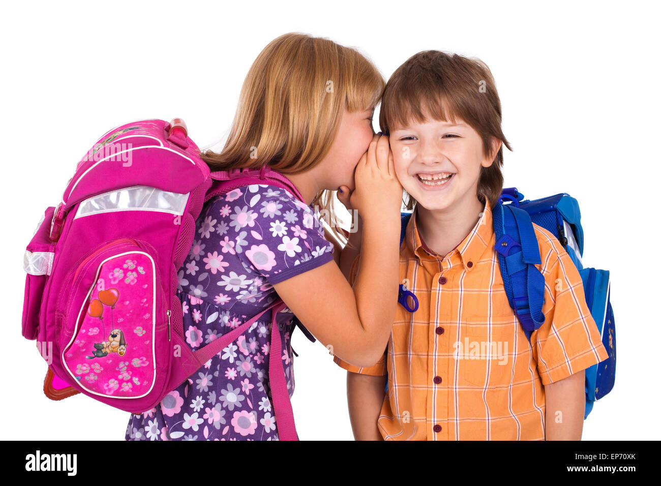 portrait of a blonde girl whispering in boy's ear Stock Photo - Alamy