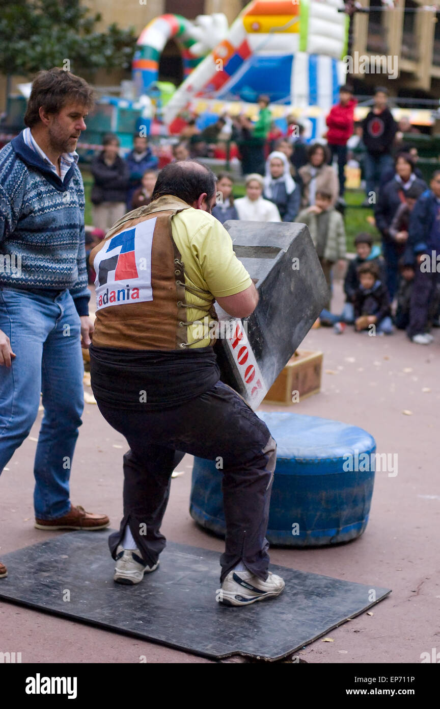 Basque rural sports. Harrijasotzaile, stone lifting, in the Santo Tomas ...
